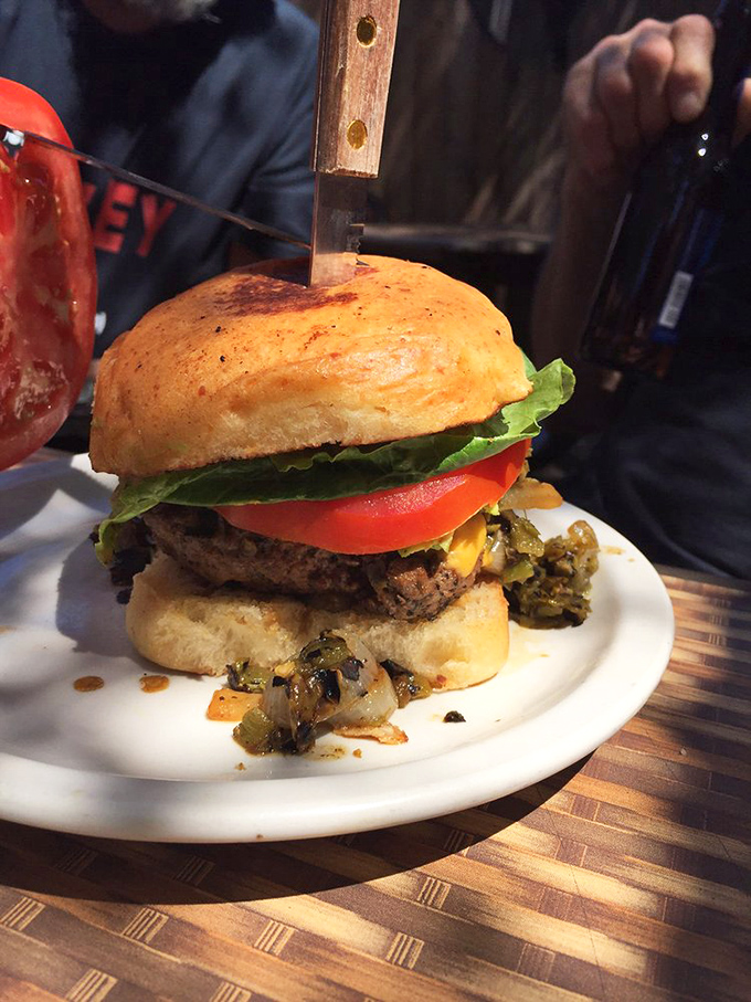 Holy cow! This burger's stacked higher than my hopes for the next "Indiana Jones" movie.