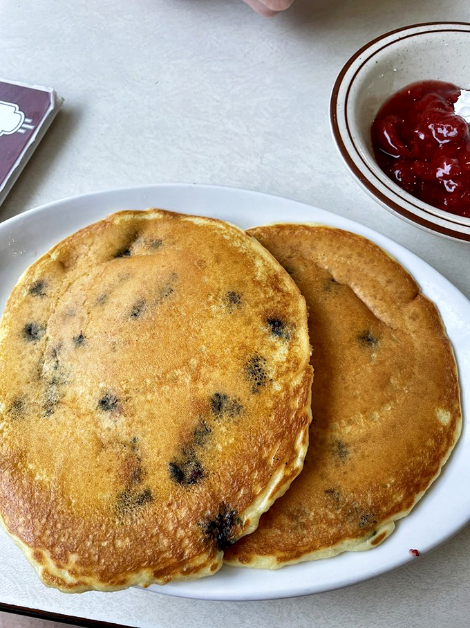 Behold, the blueberry pancake in all its glory! It's not just breakfast; it's edible sunshine that'll make you forget about your waistline.