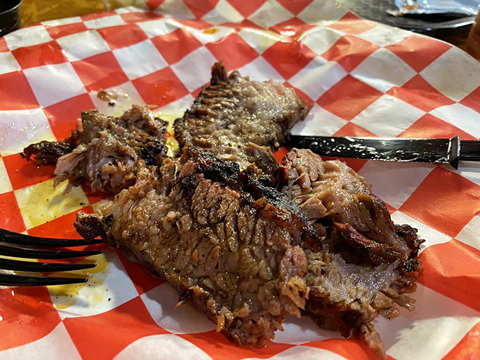 Brisket so tender, it practically melts on the plate! This isn't just meat; it's a smoky masterpiece worthy of the Louvre.