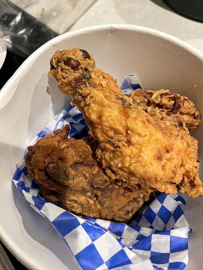 Golden-brown perfection on a blue-checkered throne. This fried chicken isn't just crispy; it's the crunch heard 'round Vermont!