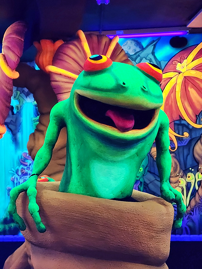 Meet your new amphibious overlord! This grinning green guy looks ready to ribbit-ribbit and roll on the mini-golf course.