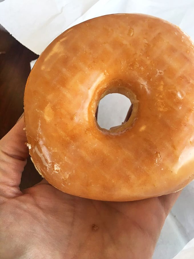 Golden perfection! This glazed donut looks so good, it could be the poster child for the "I Can't Believe It's Not Art" museum.
