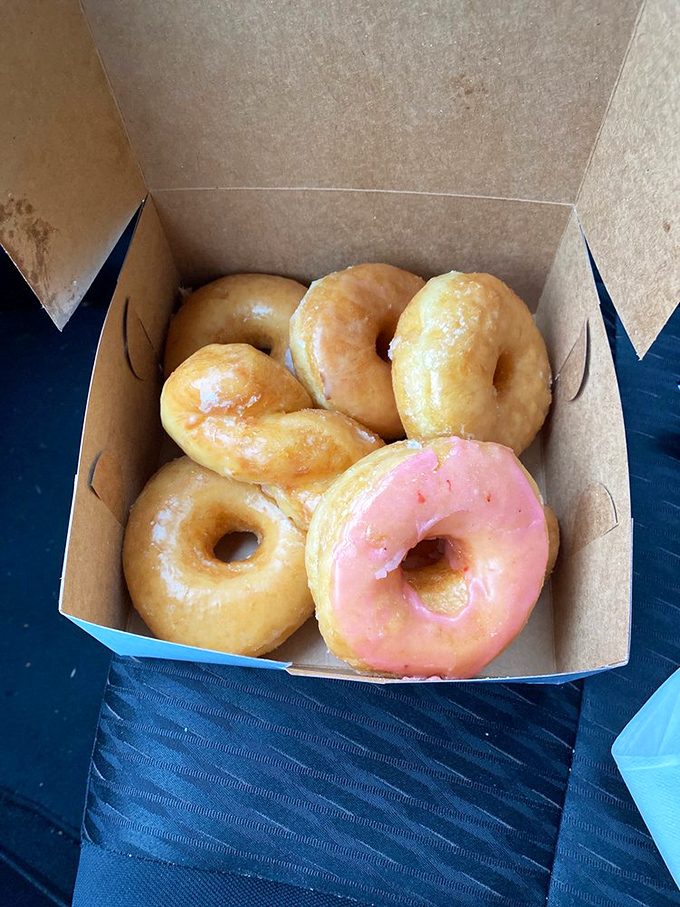 Golden rings of joy! These glazed beauties shine brighter than my future, promising a melt-in-your-mouth experience that'll make you forget all about your diet.