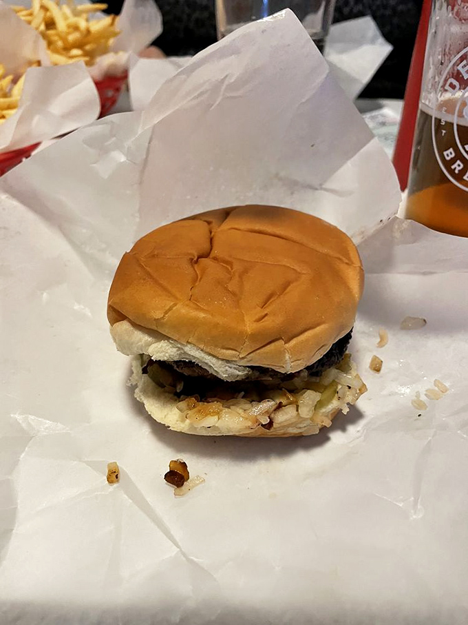 Behold, the Jucy Lucy in all its glory! This isn't just a burger; it's a molten masterpiece waiting to erupt.