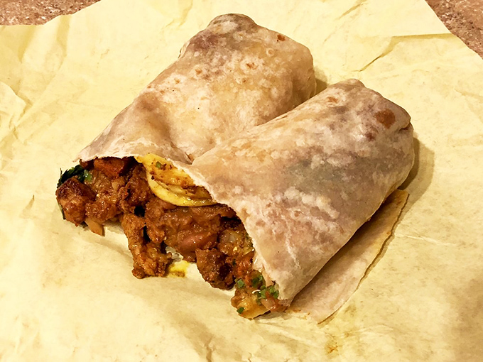 Burrito bliss! This pastor burrito is so packed with flavor, it might just start its own mariachi band in your mouth.