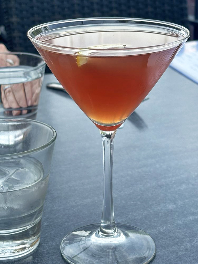 Pucker up, buttercup! This Pomegranate Cosmo is ready to sweep you off your feet faster than you can say "Sex and the City."