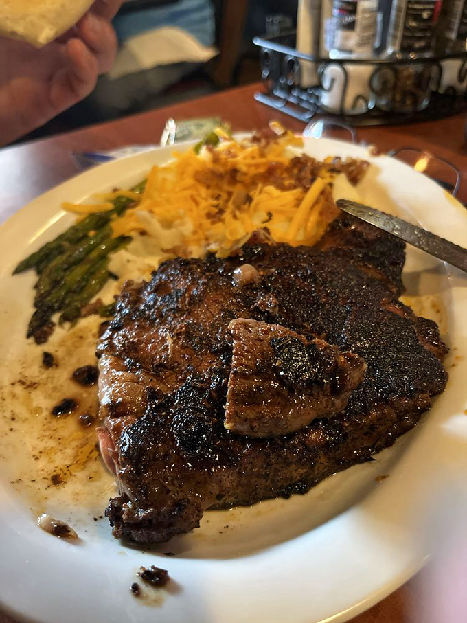 Holy cow! This ribeye's so perfectly seared, it could make a vegetarian weep. Those loaded mashed potatoes? Pure comfort on a plate.