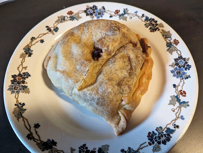 Meet the Turkey Cranberry Pasty: Thanksgiving's portable cousin! This golden-brown beauty is ready to stuff your face, not your turkey.