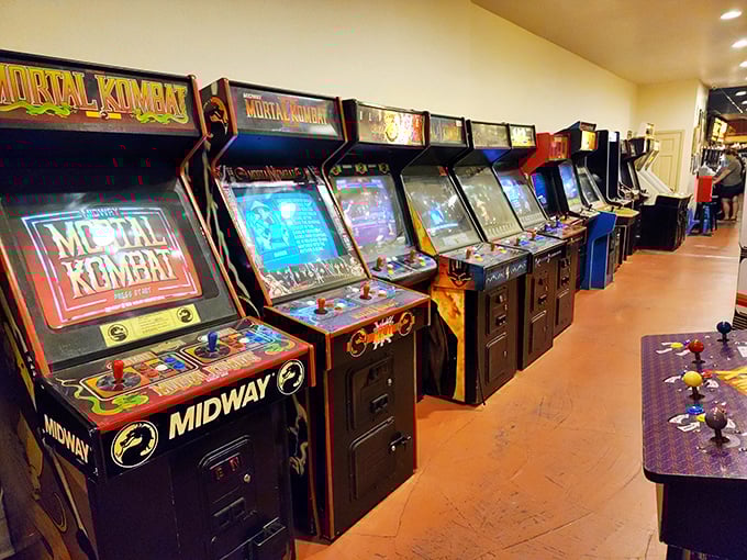 Mortal Kombat, Street Fighter, oh my! This row of arcade cabinets is like a hall of fame for pixelated pugilists.