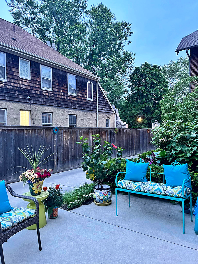 Backyard bliss alert! This colorful oasis is the perfect spot to sip your morning coffee or plot world domination &ndash; your choice.