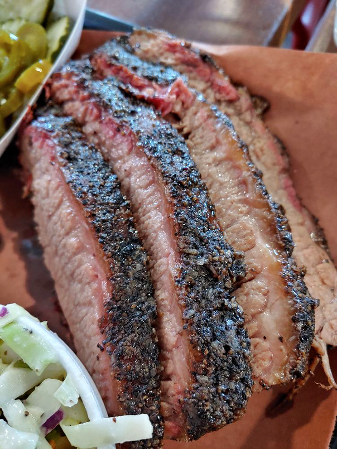 Brisket so tender, it practically slices itself. This isn't just meat; it's a work of art that would make Michelangelo weep with joy.
