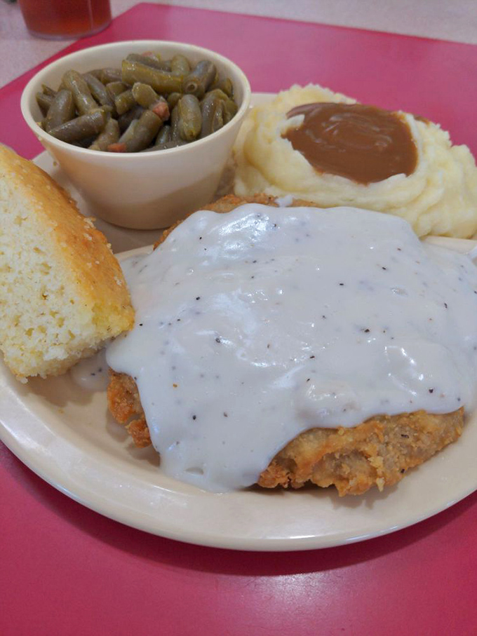 Southern comfort on a plate! This country fried steak is so tender, it practically cuts itself. Paired with creamy gravy, it's a hug for your taste buds.