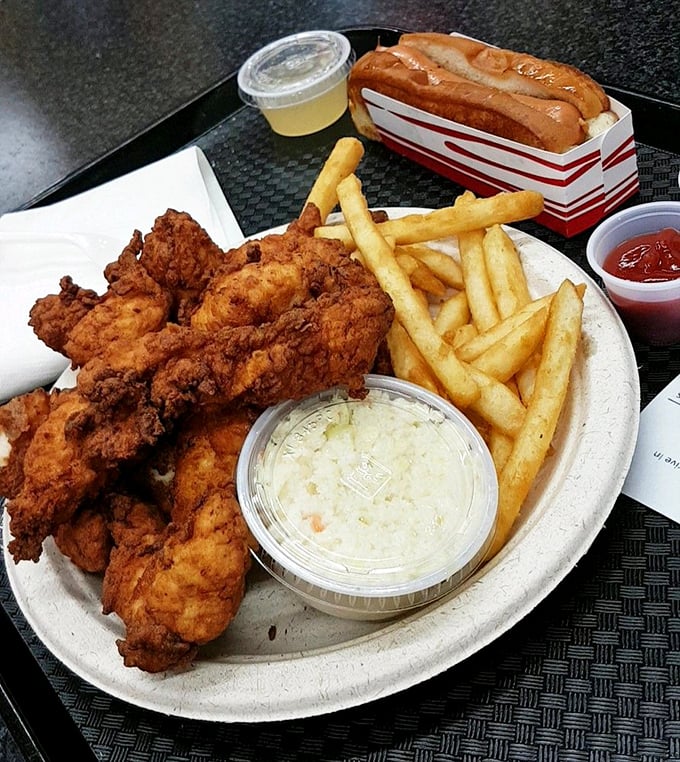 Behold, the star of the show! This golden-brown chicken is crispier than a New England autumn leaf and juicier than gossip at a church picnic.