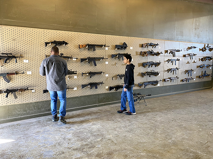 Guns, guns everywhere, but not a shot to fire... yet. This wall could make even John Wick pause and whistle in appreciation.