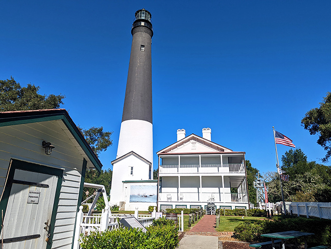 Lighthouse, meet plantation style. It's like "Gone with the Wind" decided to guide ships instead of Rhett Butler.