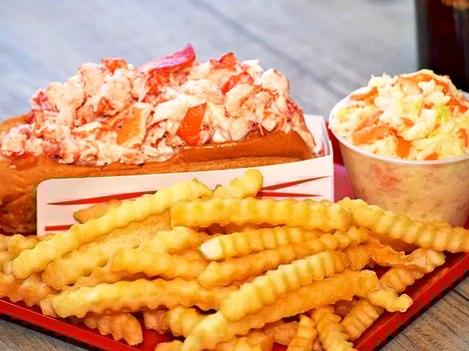 Lobster roll perfection: a buttery bun cradling a mountain of succulent meat. It's like a warm hug for your stomach.