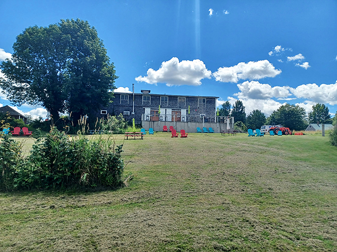 Adirondack chairs in Crayola colors dot the lawn, inviting you to kick back and sip while soaking in views that rival any screensaver.