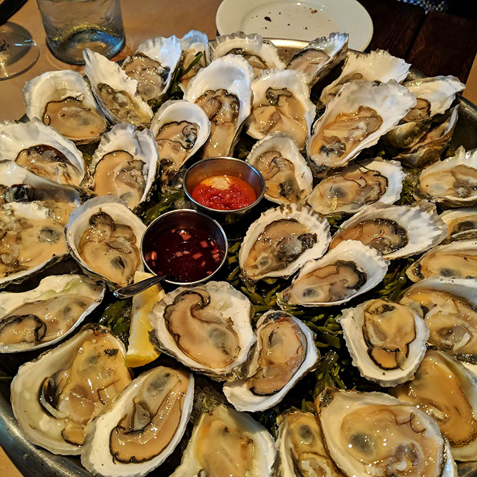 Oyster heaven! These briny beauties are arranged like nature's jewelry box, just waiting to be savored. Who needs pearls when you've got these gems?