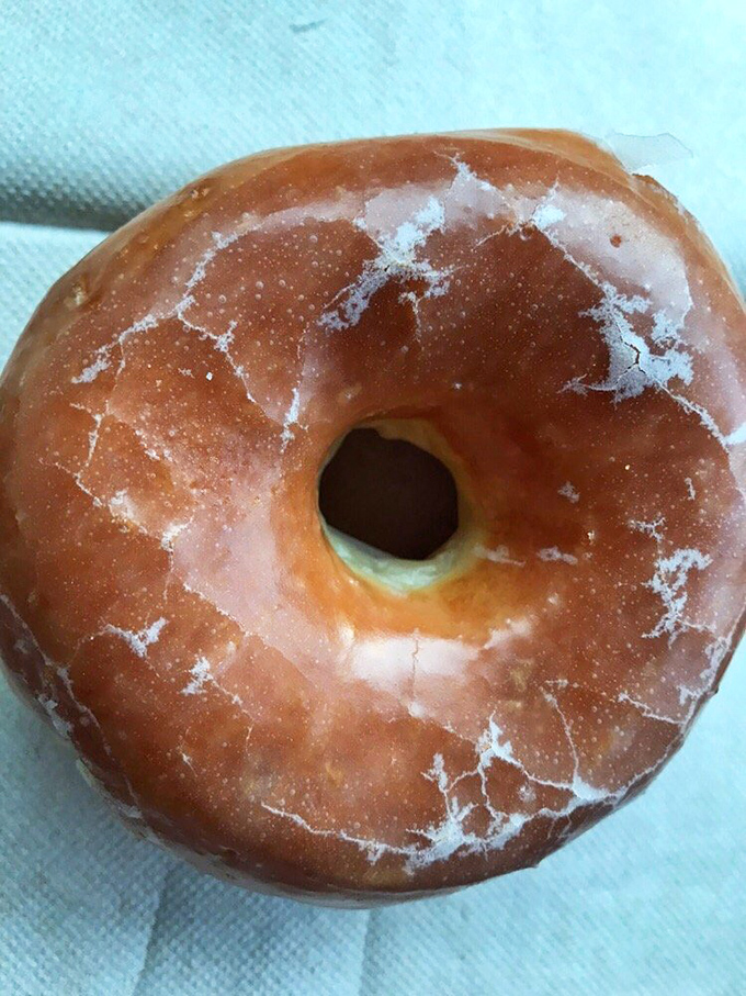 Behold, the humble glazed donut in all its glory. This isn't just breakfast; it's a hug for your taste buds.