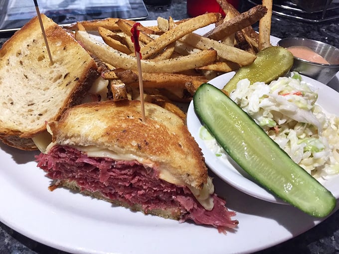 The Reuben that ate Manhattan! This towering sandwich, flanked by crispy fries and tangy slaw, is a meal fit for a king &ndash; or a very hungry commoner.