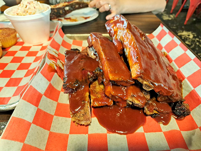 Behold, the holy grail of BBQ! These ribs are so tender, they practically fall off the bone with a stern look. Napkins are not optional, folks.