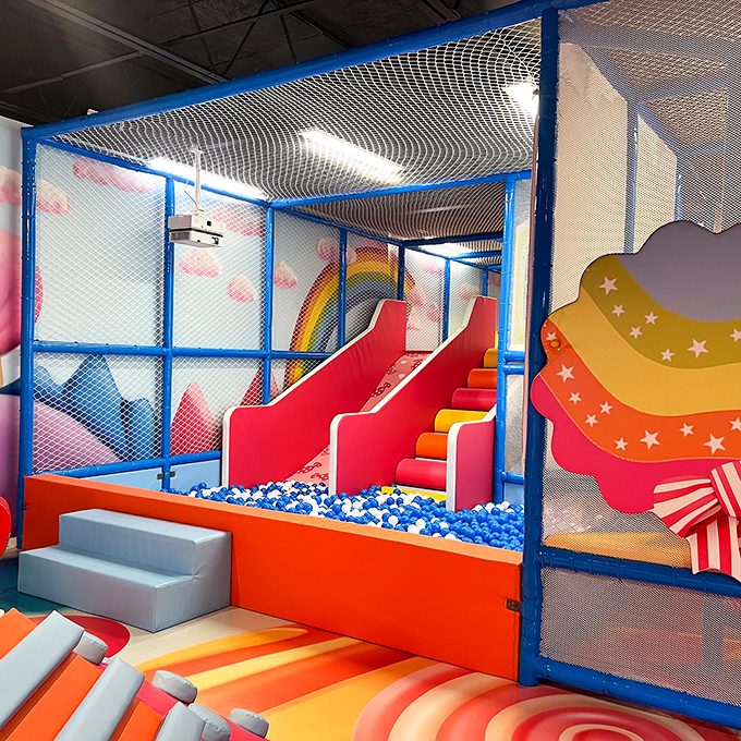 Slide into a sea of blue and white balls - it's like diving into a pool of blueberry-flavored Dippin' Dots, minus the brain freeze!