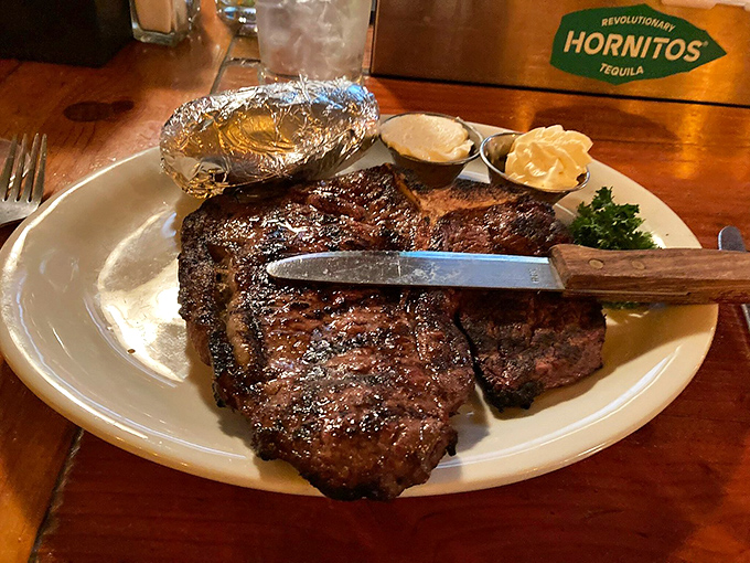 Holy cow! This T-bone steak is so massive, it might just have its own zip code. Baked potato sidekick included for scale (and deliciousness).