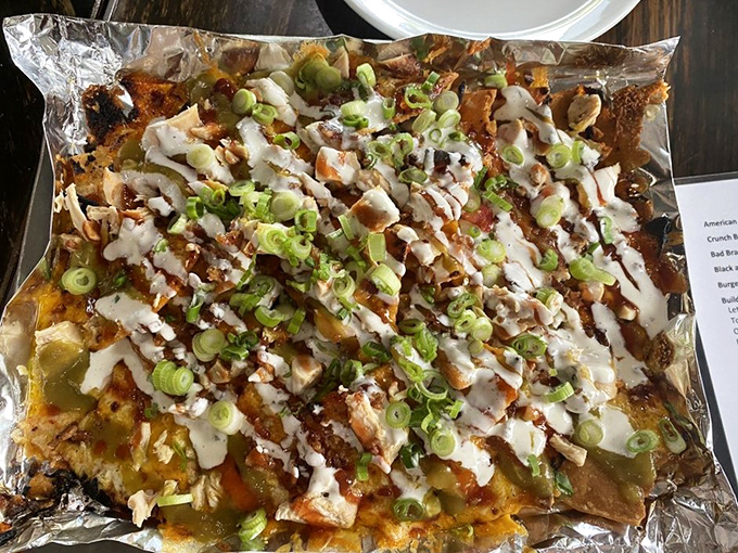 Behold, the BBQ nacho mountain! It's like someone took Tex-Mex, gave it a smoky makeover, and said, "More cheese, please!" A true crowd-pleaser.