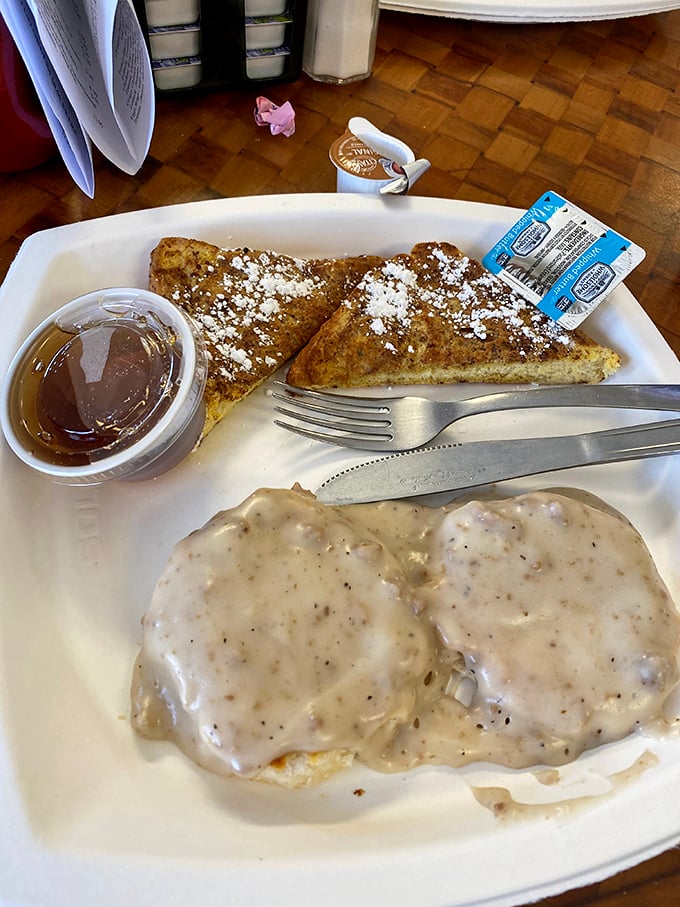 Biscuits and gravy: the breakfast of champions! This plate is comfort food incarnate, with a side of crispy bacon that's music to your arteries.
