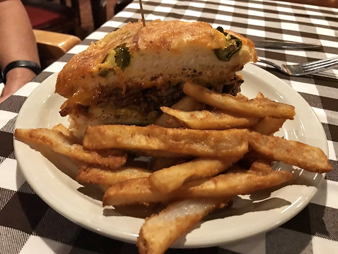 The sandwich that launched a thousand cravings. This brisket beauty is stacked higher than your grandpa's tales of "walking uphill both ways."