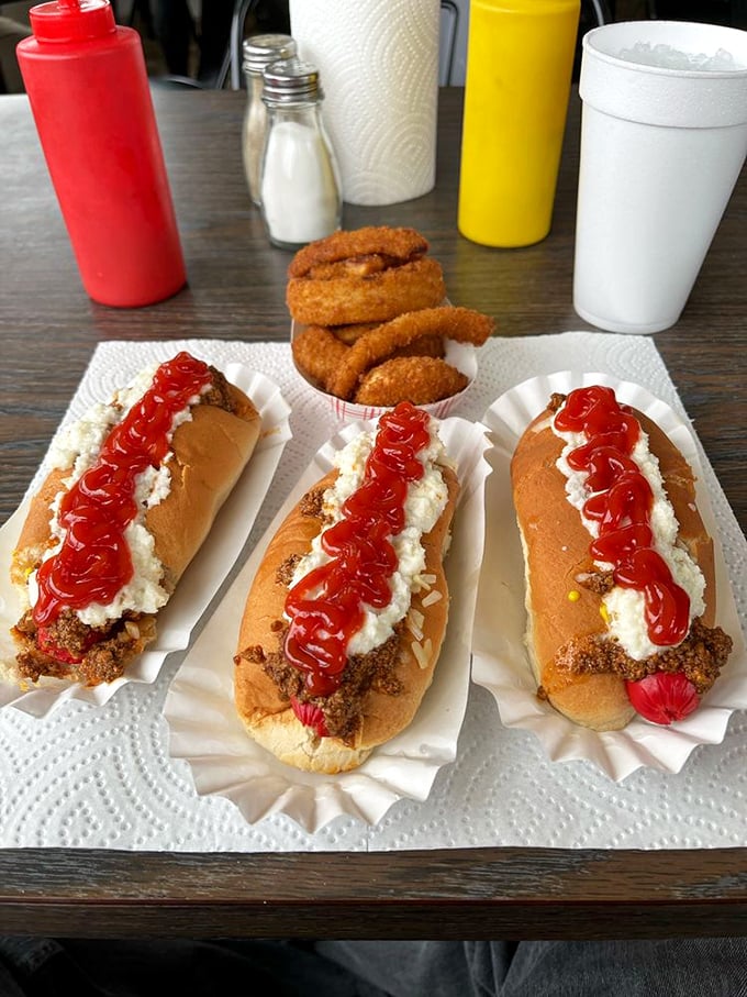 Behold, the holy trinity of hot dog heaven! These chili-smothered beauties are what dreams (and occasional heartburn) are made of.