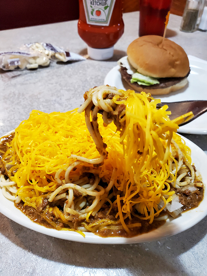 Behold, the crown jewel of Cincinnati cuisine! This mountain of chili-topped spaghetti is what food fantasies are made of.
