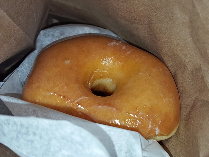Behold, the Holy Grail of breakfast! This classic glazed donut glistens with promise, ready to make your taste buds sing.