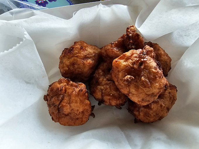 Golden orbs of joy! These conch fritters are like edible sunshine, ready to brighten your day one crispy bite at a time.