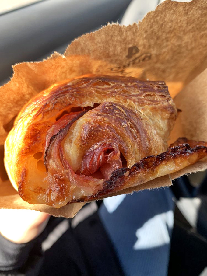 Behold, the holy grail of breakfast pastries! This croissant is so flaky, it could ghost you on social media. But trust me, it's worth the commitment.