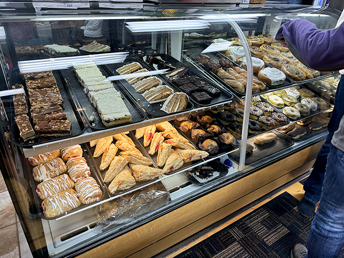Behold, the glass case of temptation! Like a museum of deliciousness, each shelf showcases edible masterpieces that belong in the Louvre of Lunch.
