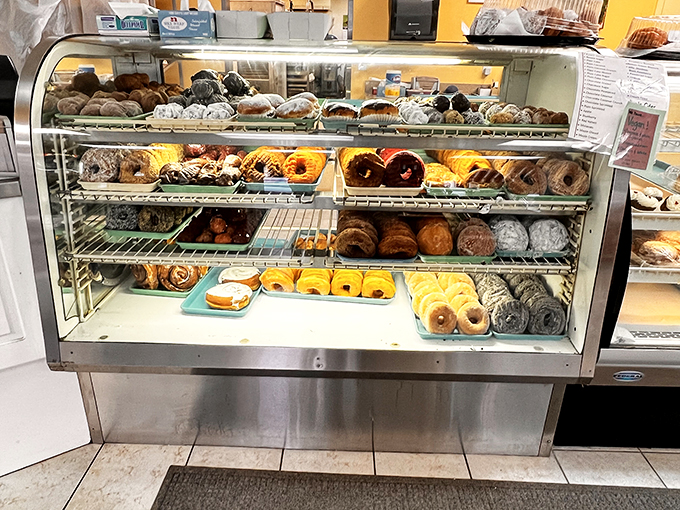 Behold, the glass case of temptation! These donuts aren't just food; they're edible works of art that would make Homer Simpson weep with joy.