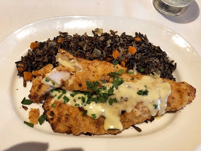 Golden-crusted perfection meets wild rice pilaf. This walleye dish is so Minnesota, it practically comes with its own accent and a side of "uff da."