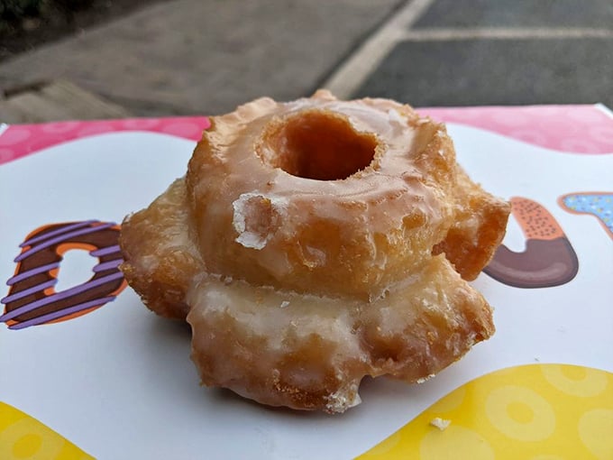 Behold, the holy grail of fried dough! This glazed beauty glistens like a sugary sunrise, promising a melt-in-your-mouth experience.