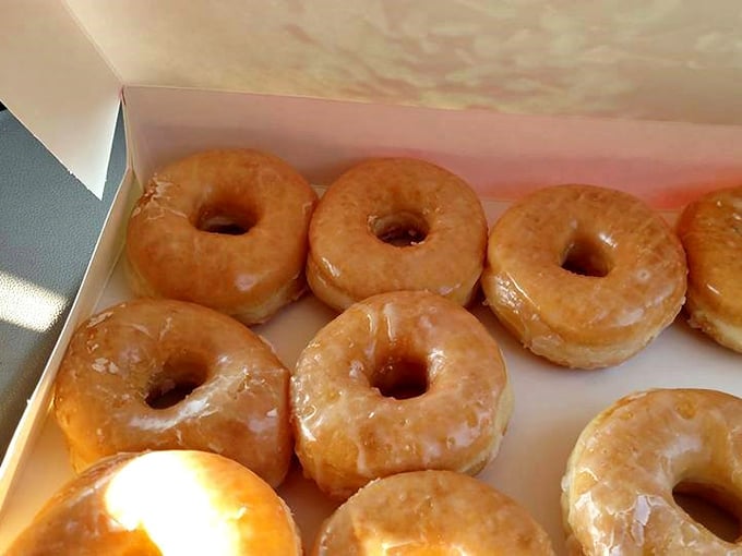 Golden rings of joy! These glazed beauties glisten like edible halos, promising a bite of heaven in every pillowy morsel.