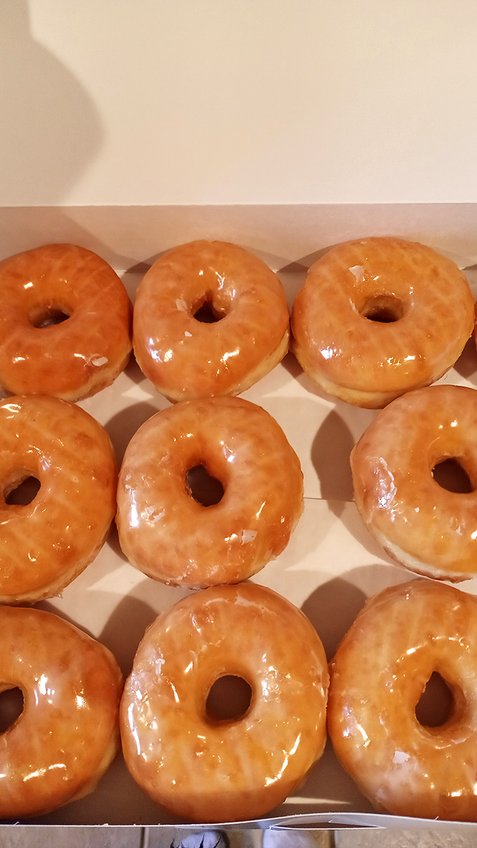 Golden rings of joy! These glazed beauties shine brighter than any Olympic medal, promising a taste of sweet victory.