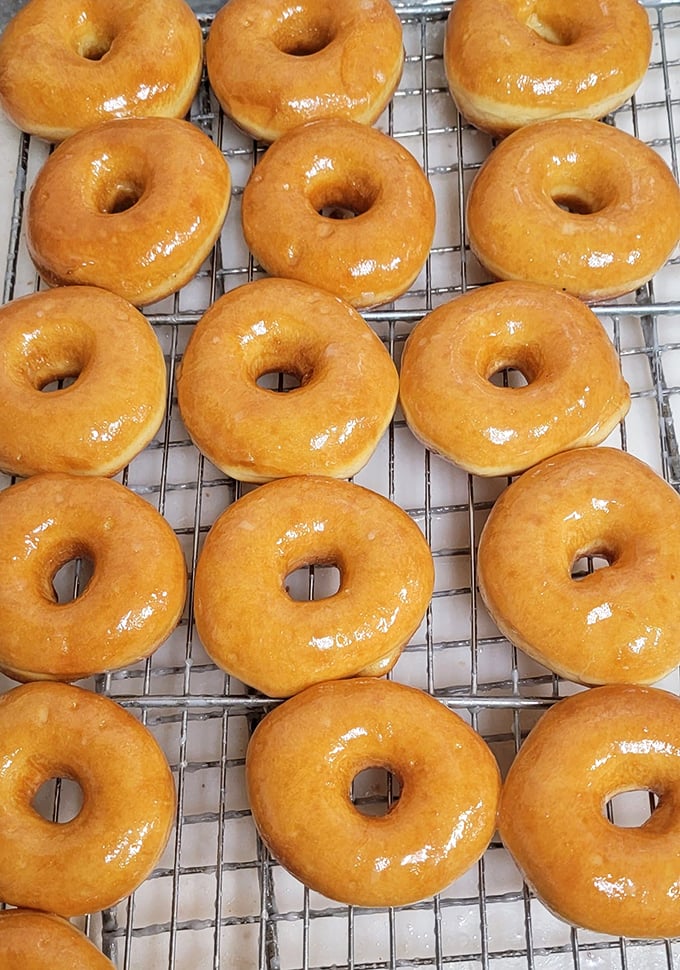 Golden rings of joy! These glazed donuts are so perfect, they could make Homer Simpson weep with happiness. Resistance is futile.