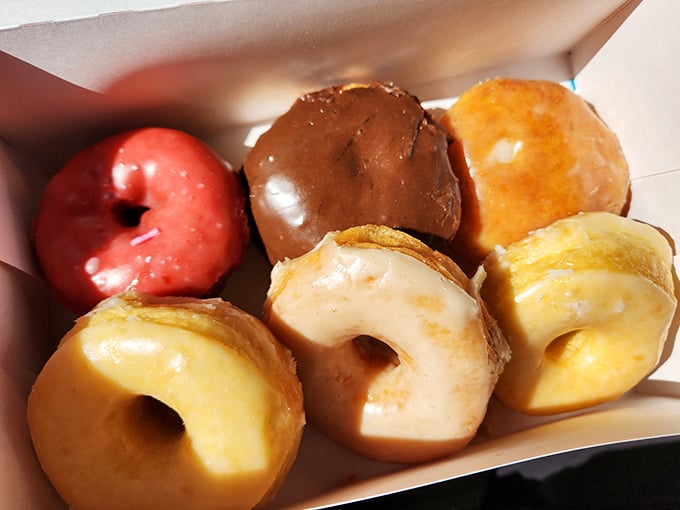 Donut nirvana in a box! These glazed beauties are the stuff of dreams, glistening with promise and begging to be devoured.