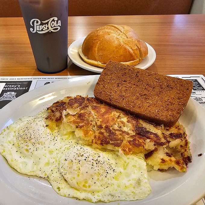 Eggs and hash browns: the dynamic duo of breakfast. This plate is like the Batman and Robin of morning meals, ready to save you from hunger's villainous clutches.