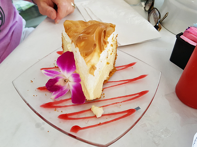 Holy key lime, Batman! This slice of heaven isn't just a dessert; it's a tropical vacation for your taste buds, complete with a flower lei.