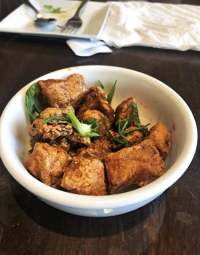 Pork nuggets that could make a vegetarian weep: Golden, crispy, and nestled in a bowl of temptation, these bites are the stuff of meaty dreams.
