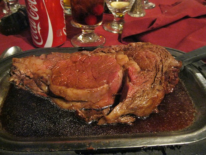 Behold, the pi&egrave;ce de r&eacute;sistance! This prime rib isn't just a meal, it's a monument to bovine perfection. Juicy, tender, and big enough to make Fred Flintstone jealous.