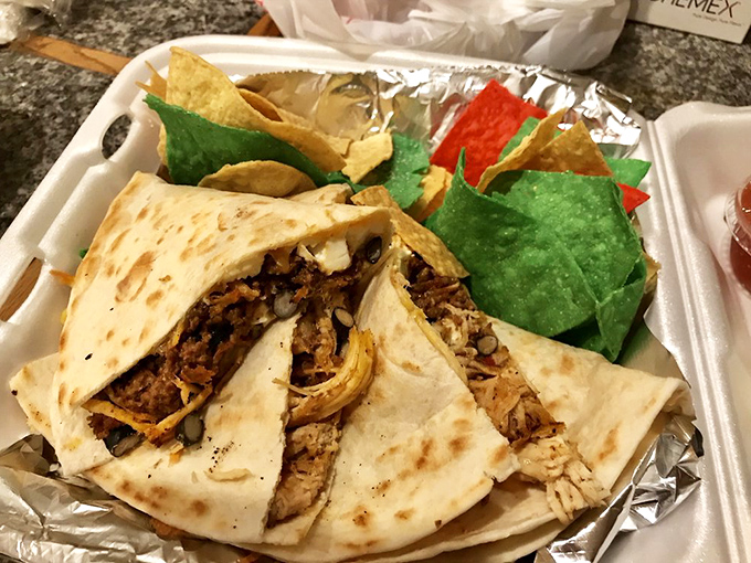 Behold, the quesadilla that launched a thousand return visits! It's not just a meal, it's a cheesy masterpiece.