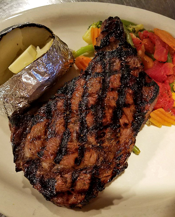 Holy cow, that's a steak! This rib eye looks like it could make a vegetarian weep with temptation. Grill marks of glory!