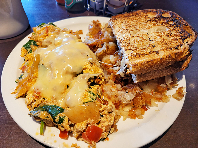 Eggs-cellence on a plate! This scramble is so fluffy, it might just float away if you don't catch it with your fork.